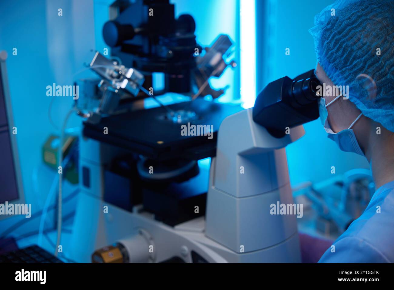 Female lab worker using specialized hi-res stock photography and images ...