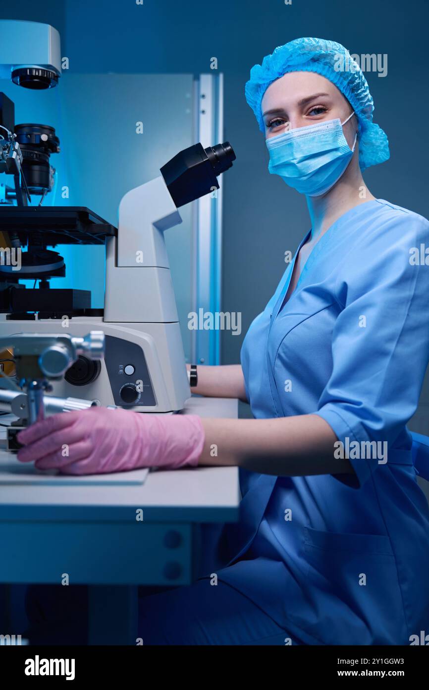 Lab technician posing with micro-manipulation equipment Stock Photo - Alamy