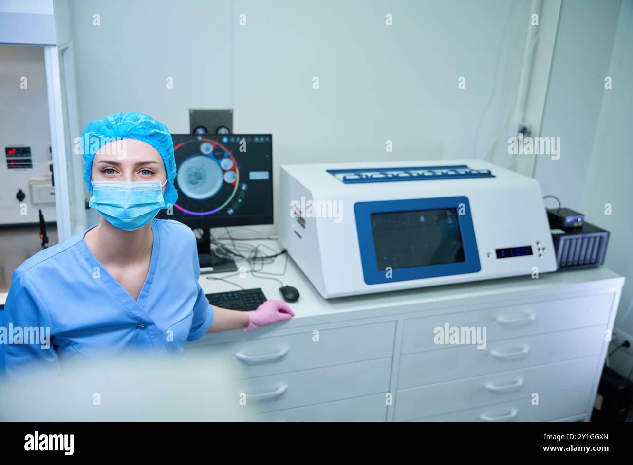Laboratory technician smiles while monitoring embryo development Stock ...