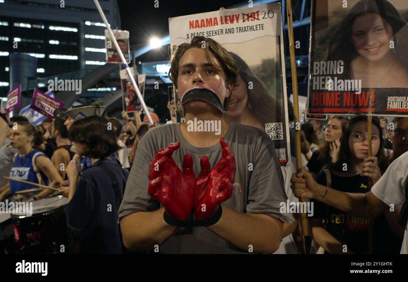 TEL AVIV, ISRAEL - SEPTEMBER 5: A protestor with his hands tied with a ...