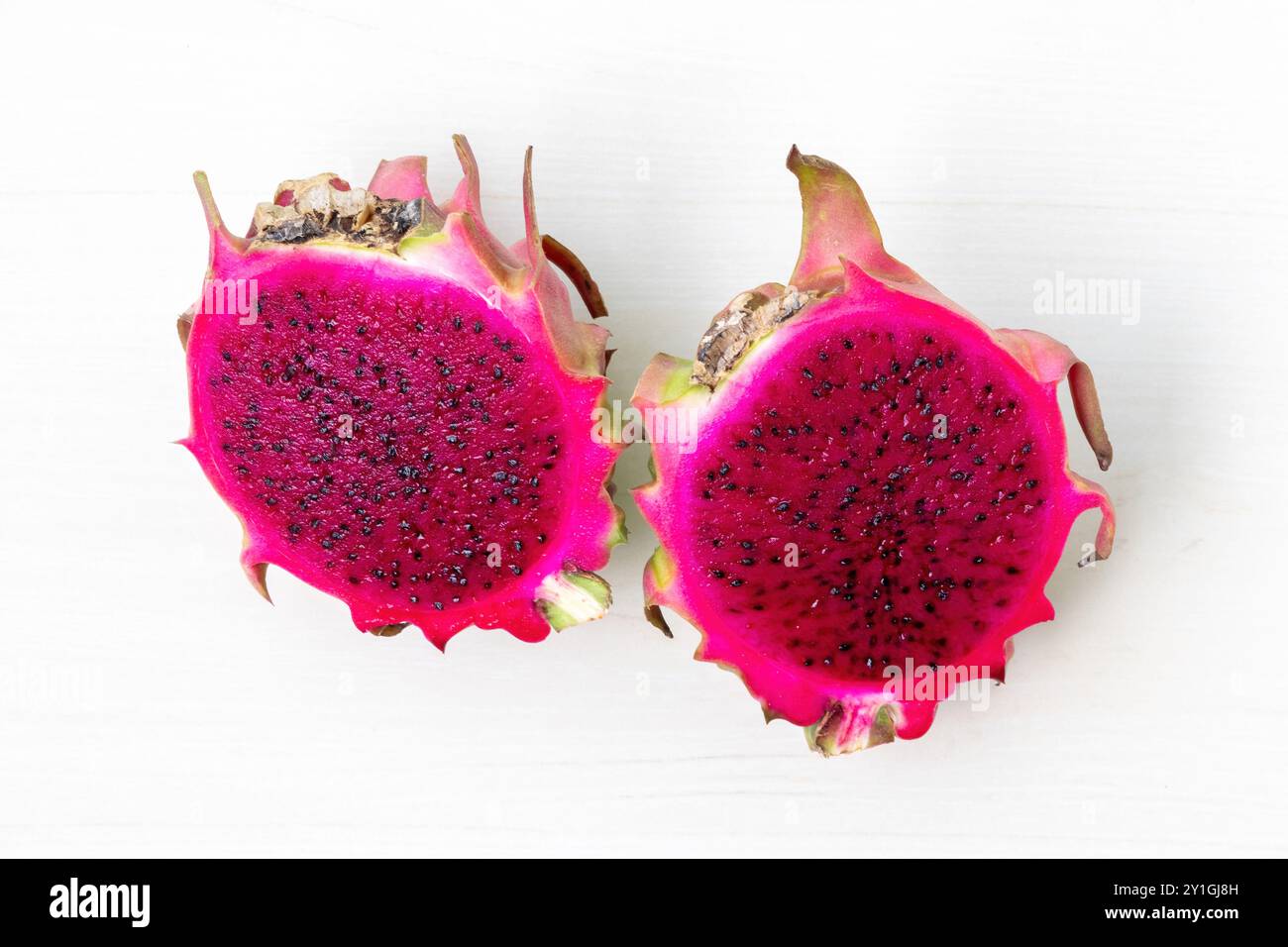 Fresh red dragon fruit cut into two pieces on white background Stock ...