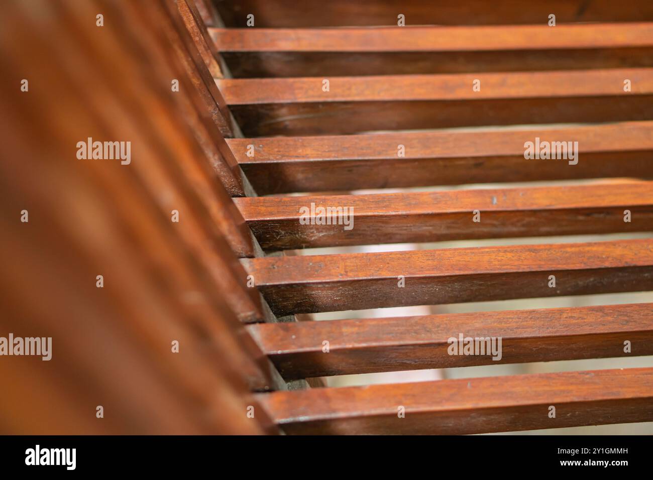 Close-up view of wooden slats, showcasing a rich brown finish and ...