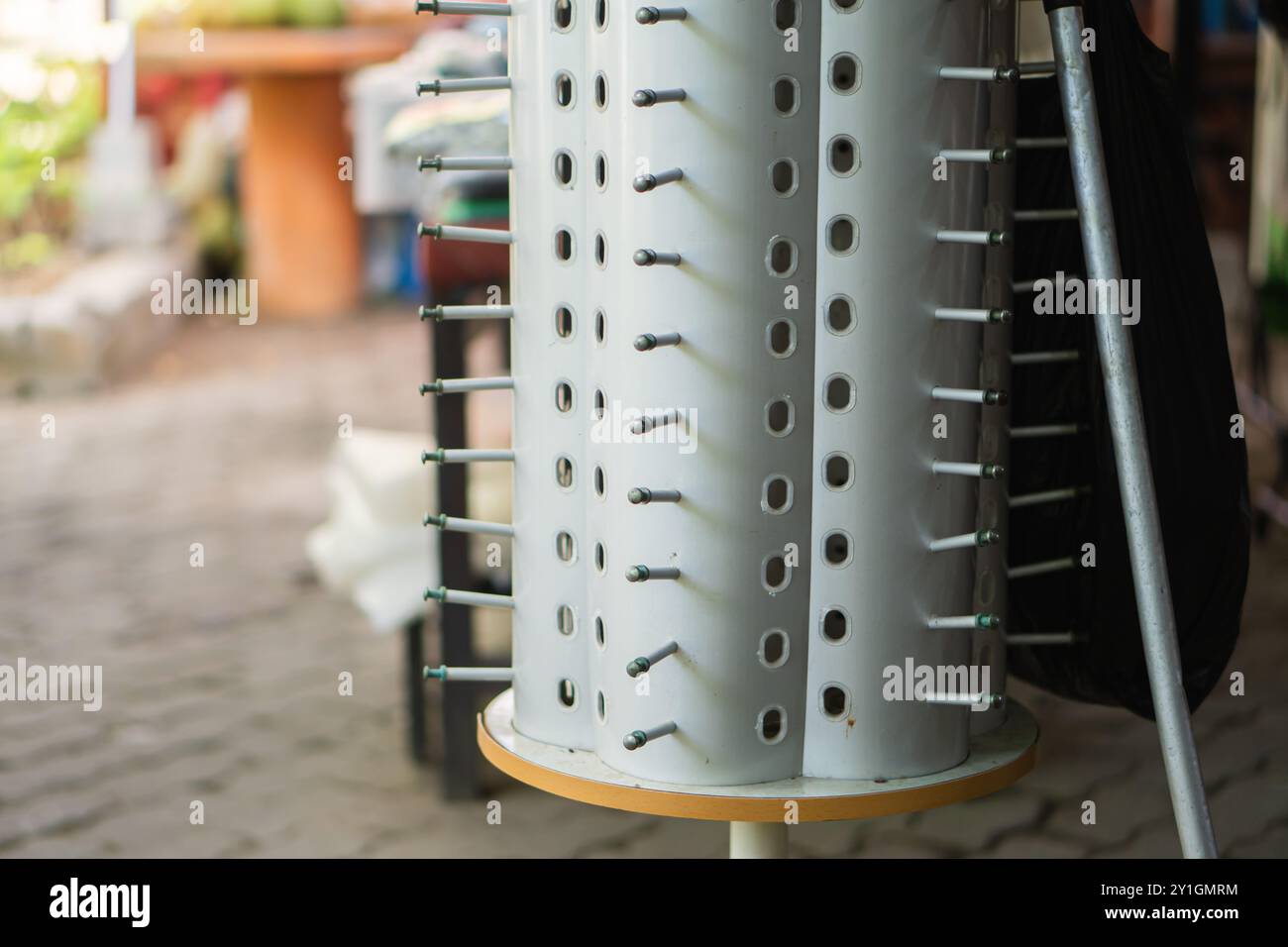A close-up of a white cylindrical structure with multiple protruding ...