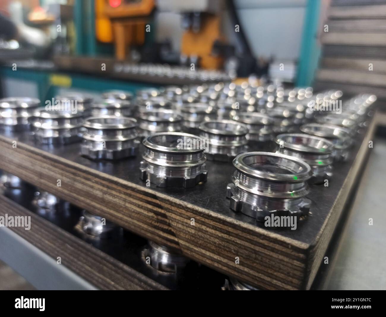 Production of lead parts. Car battery element. Clamp Stock Photo - Alamy