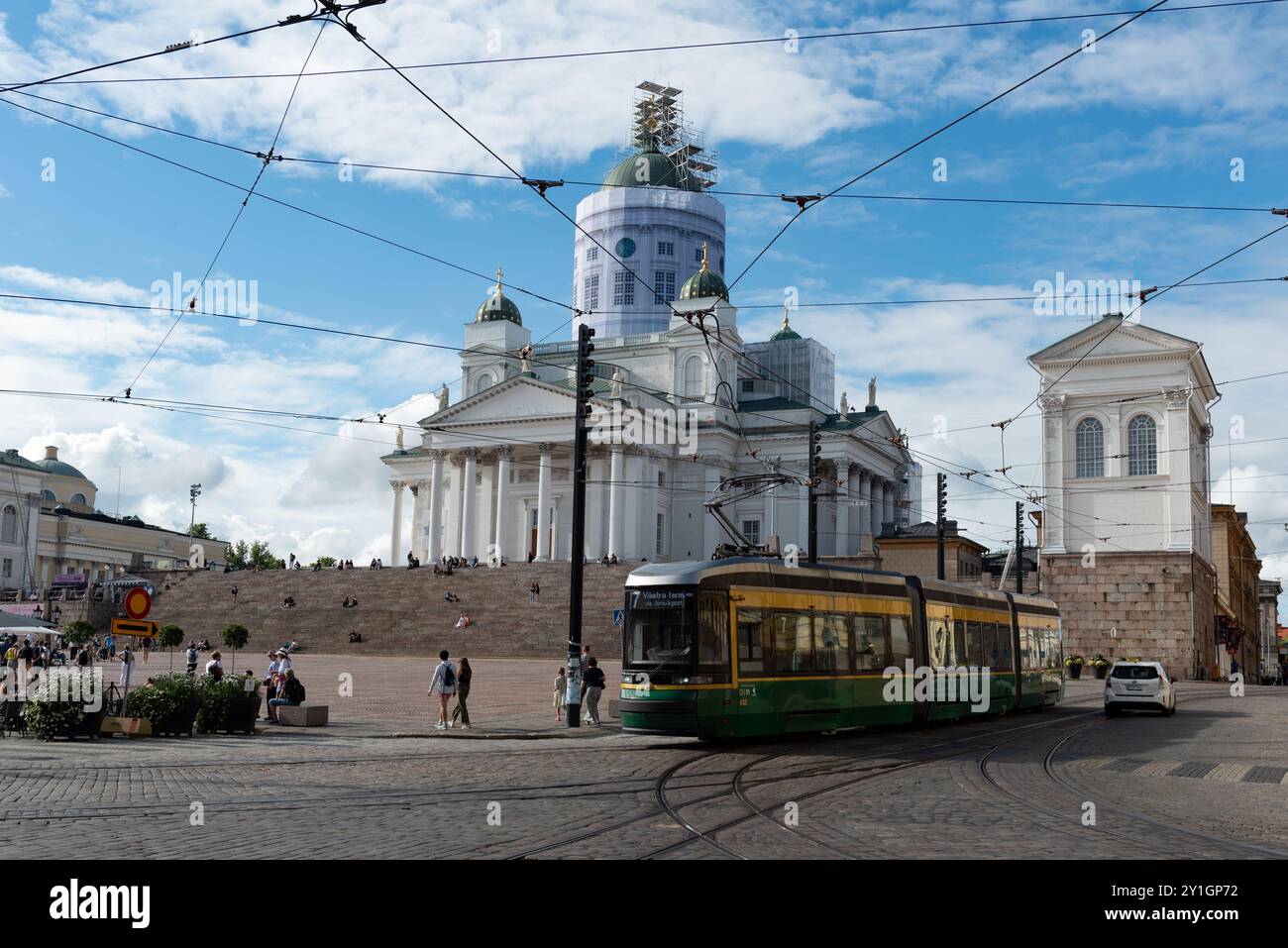 Public transport tram passing near cathedral of Helsinki in the centre ...