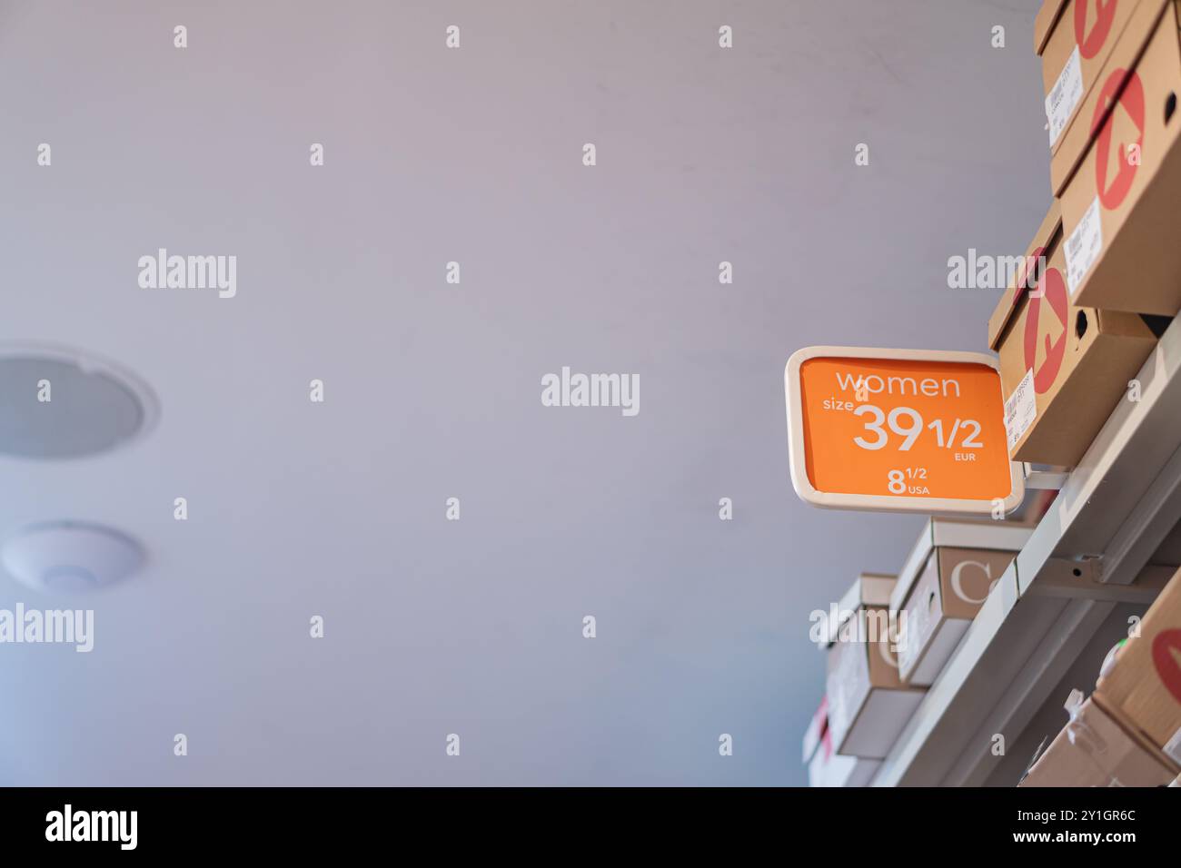 A retail display showing woman’s shoe sizes, specifically size The sign ...