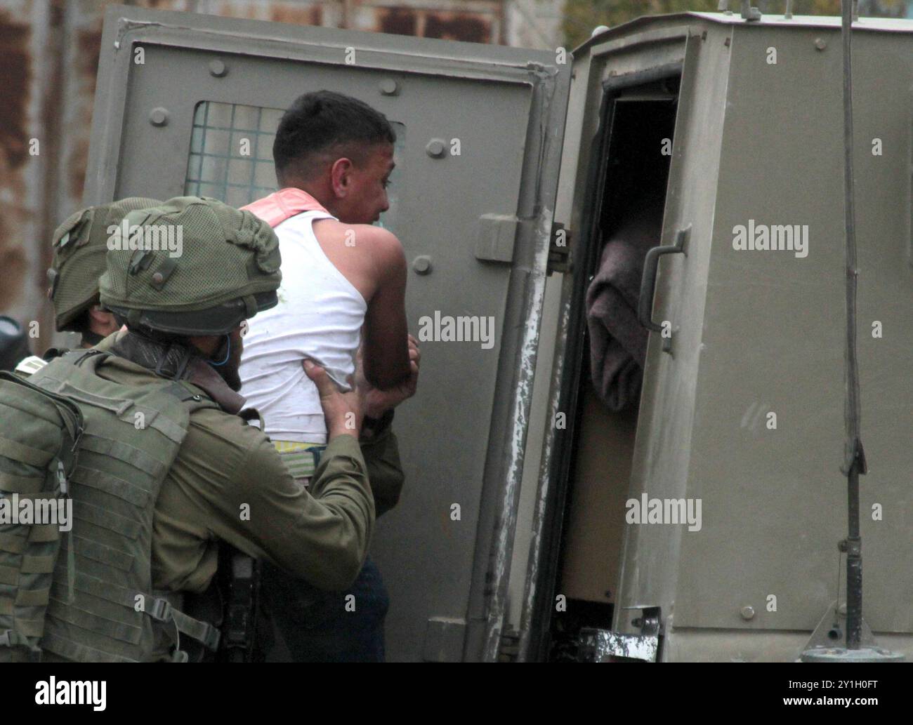 Palestinians are arrested by the Israeli Security Forces in the town of ...