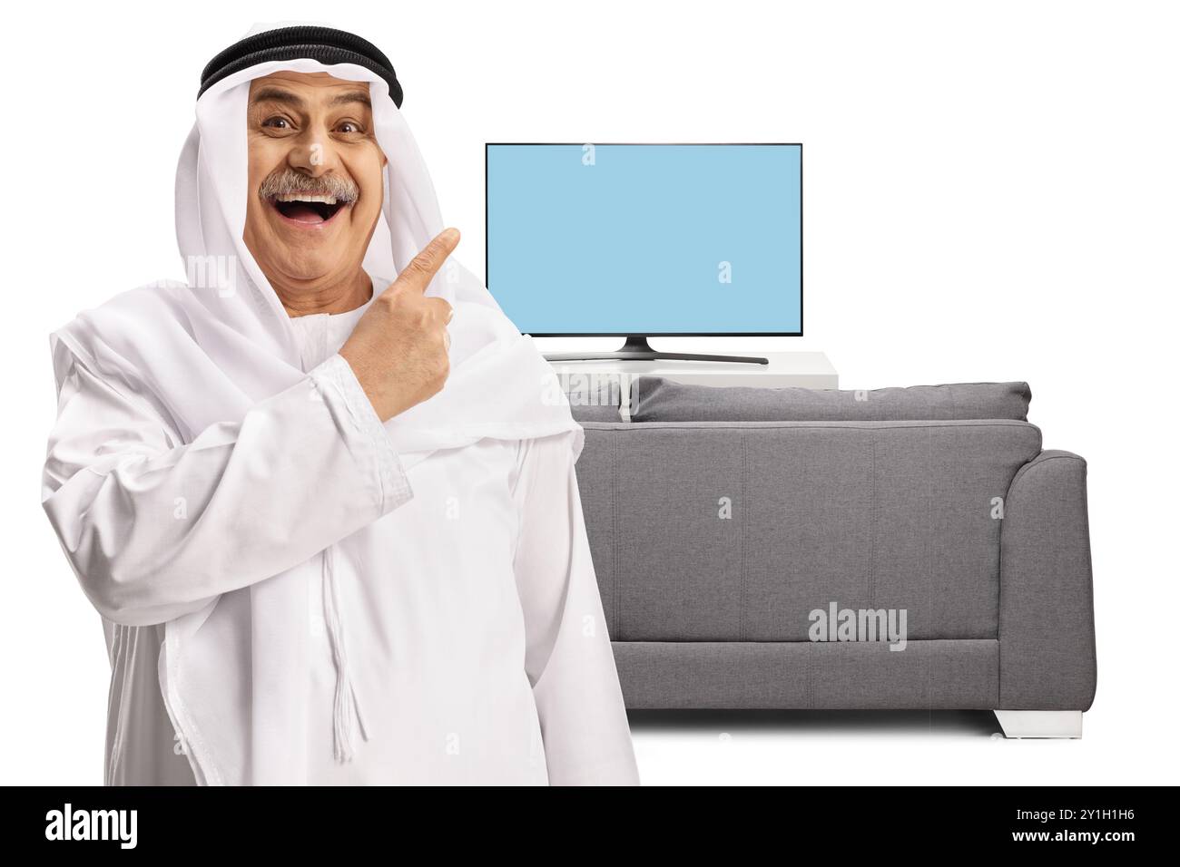 Happy mature arab man pointing at a tv screen isolated on white ...
