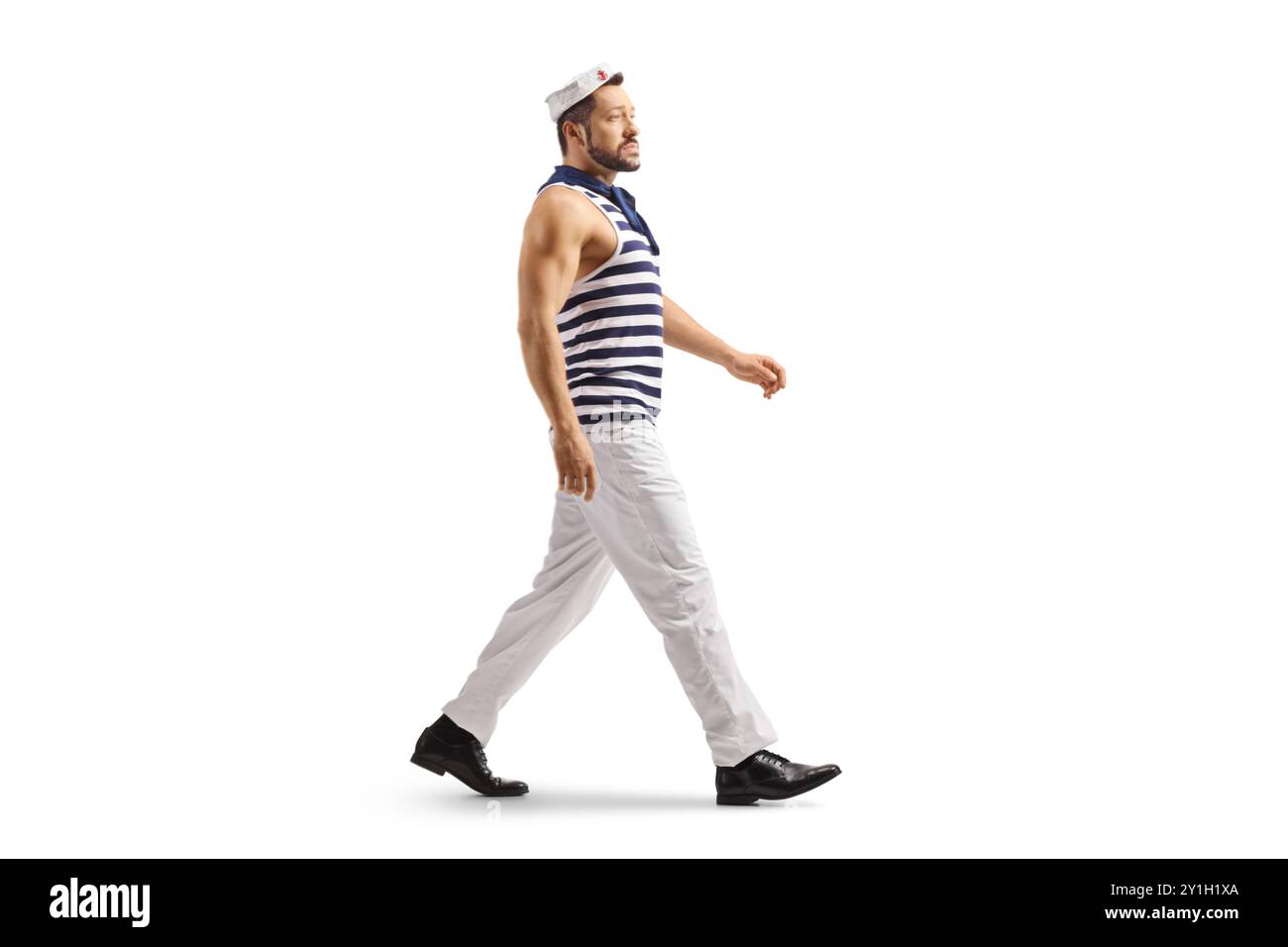 Full length profile shot of a sailor walking isolated on white ...