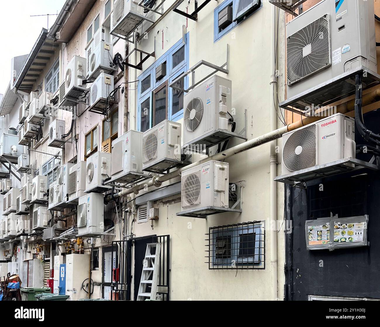 Singapore, 1 June 2024: many air-cons on the back-street facade of ...