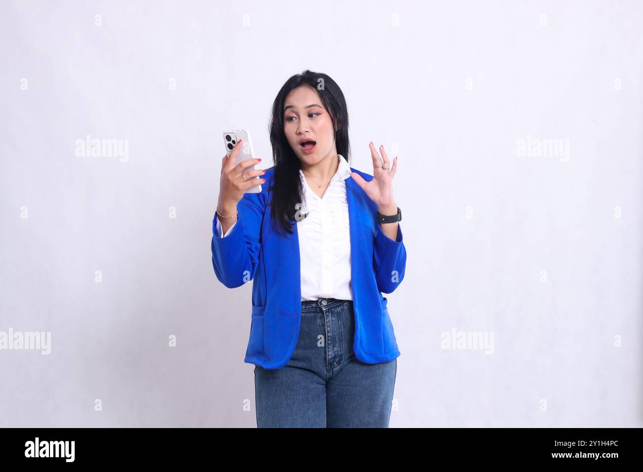 beautiful young office woman wearing blue formal suit standing shocked ...