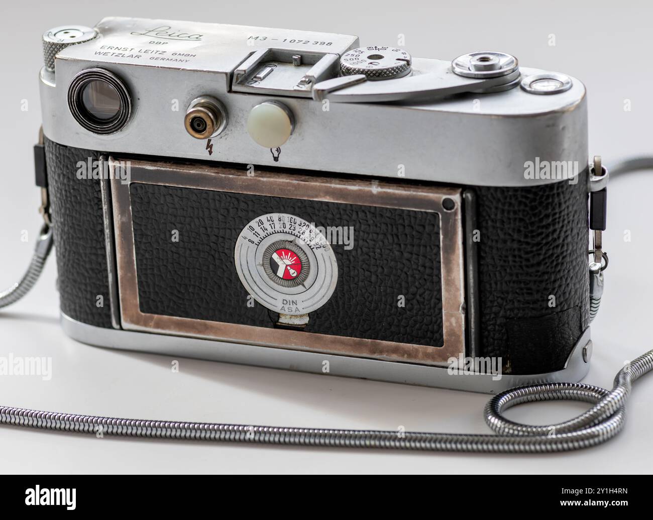 The back view of a classic vintage photo camera isolated in a white ...