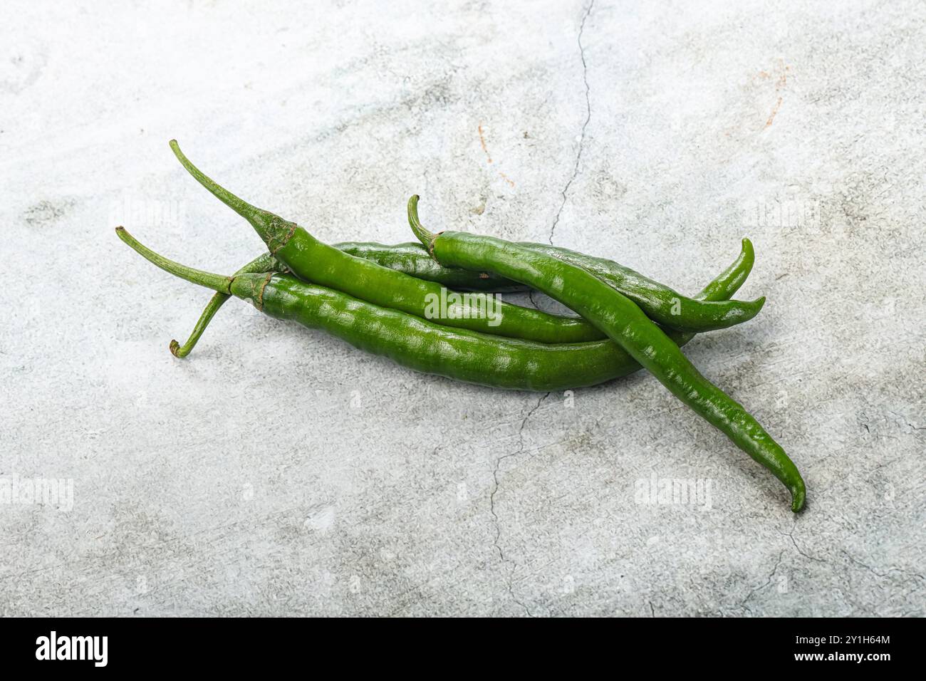 Hot and spicy green chili pepper heap Stock Photo - Alamy