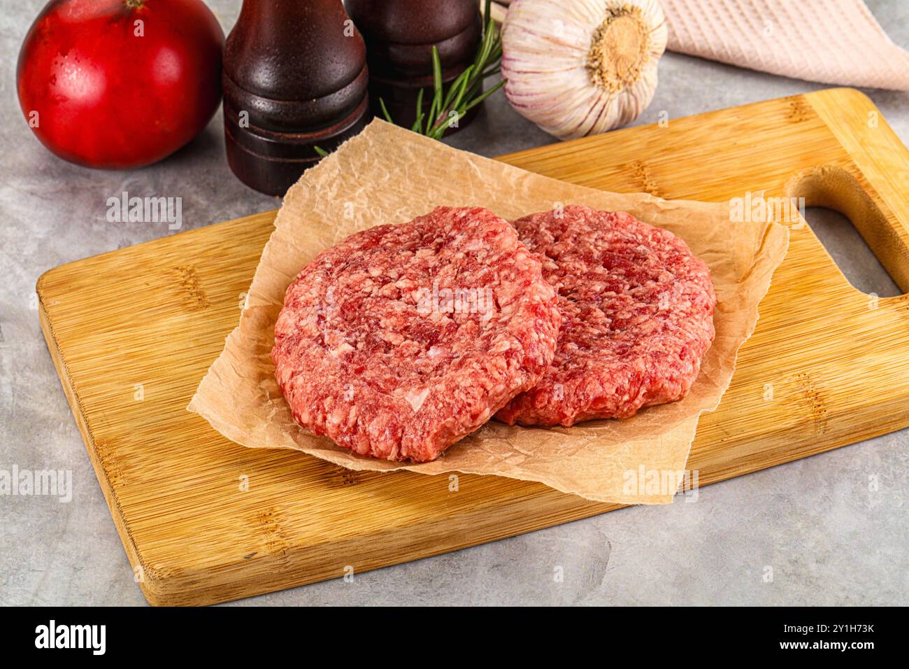 Raw round uncooked beef cutlet minced meat Stock Photo - Alamy