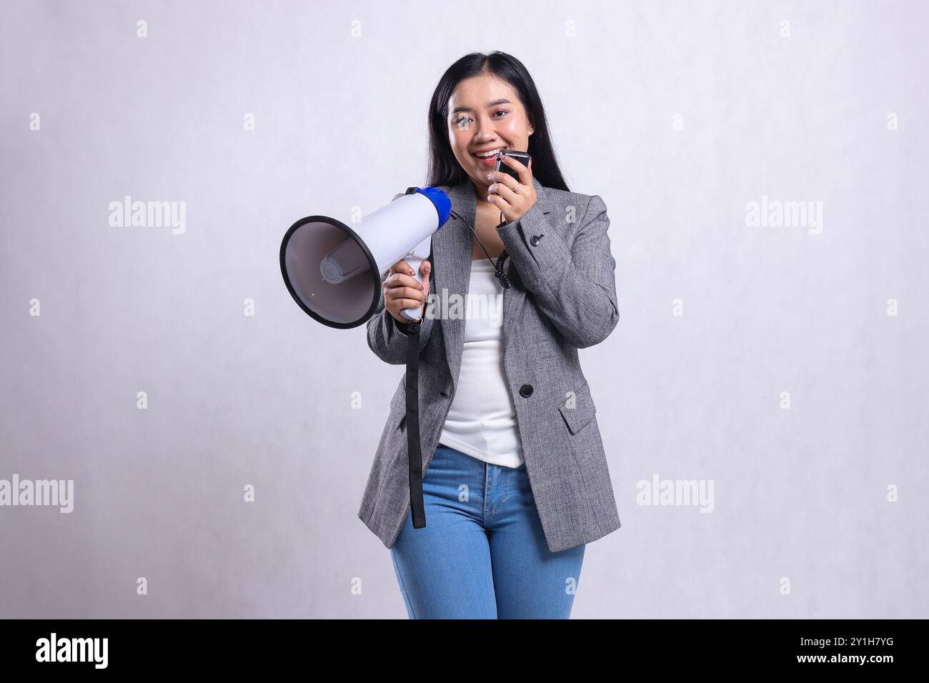 beautiful young woman shouting formal cheerful hand holding loudspeaker ...