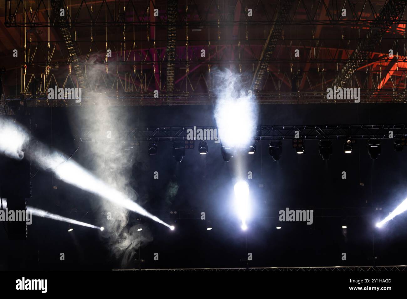 Spotlights illuminate the stage with a strong white light Stock Photo ...