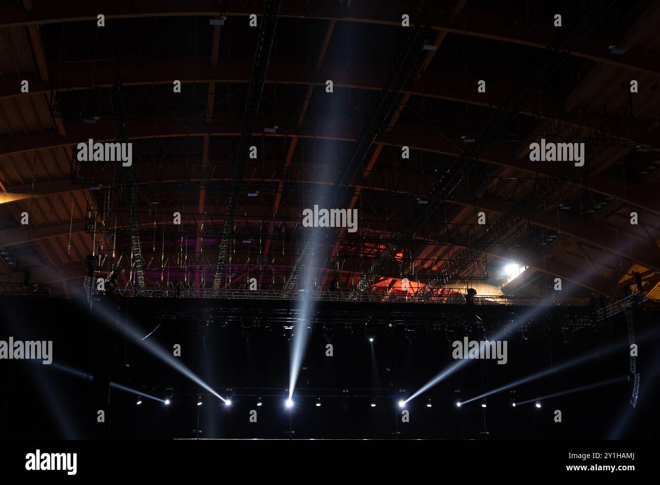 Illuminating spotlights illuminate the hall from the stage Stock Photo ...