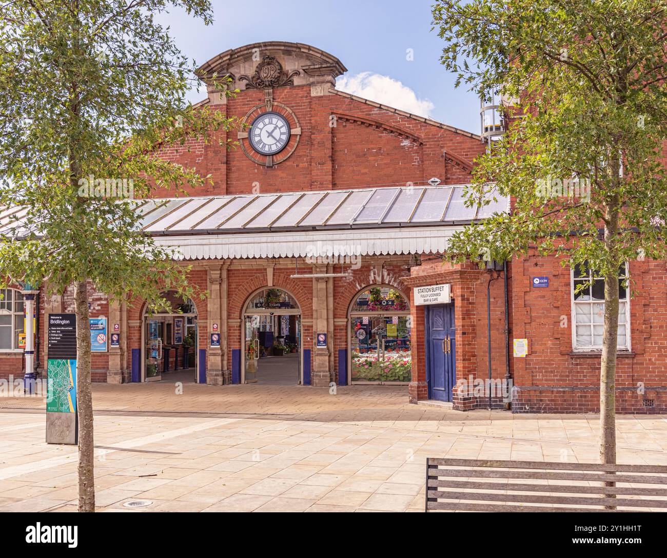 The entrance to a railway station with the doors open to the foyer ...
