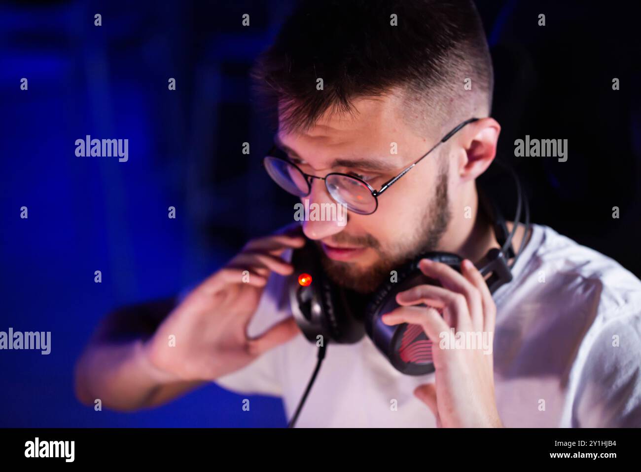 Team of gamers put on headsets at PC computer club, cyber sport ...