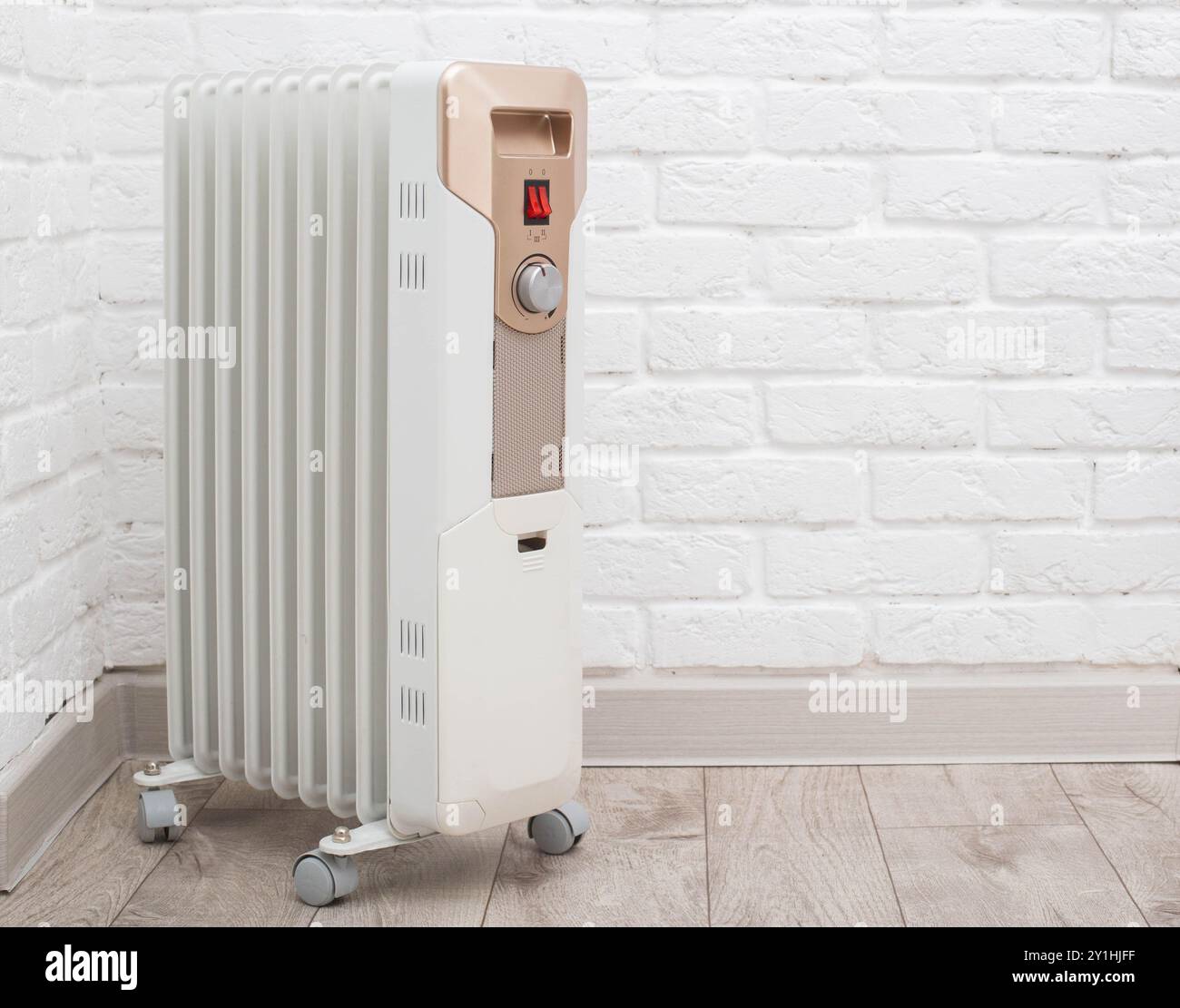 Electric heating radiator with temperature control on the background of ...