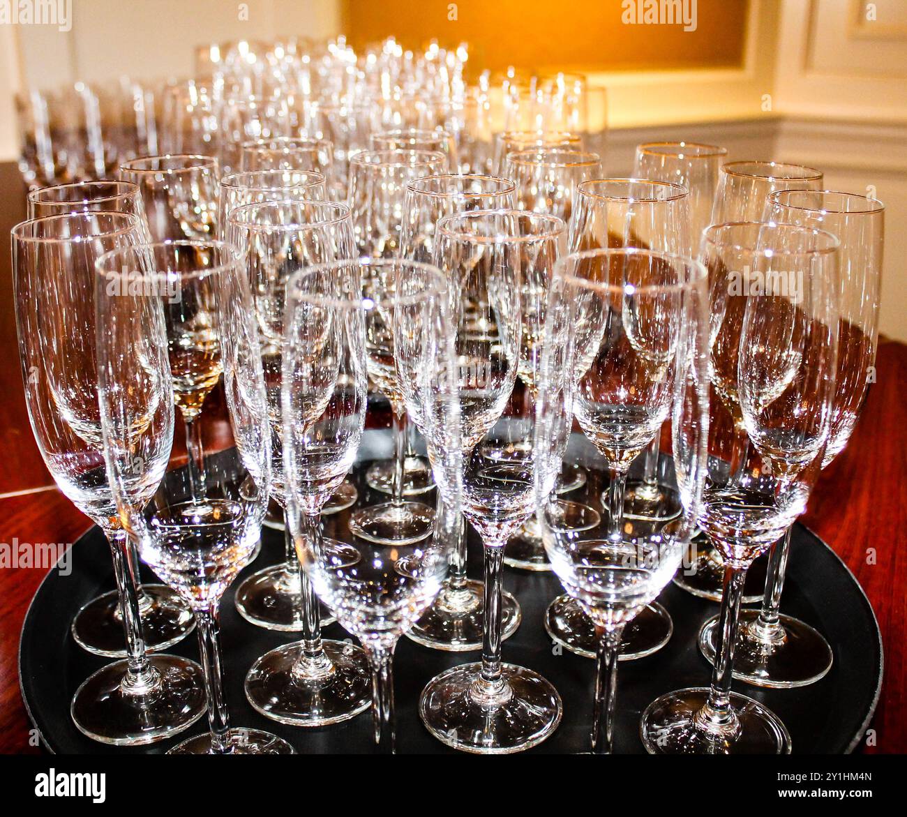 A collection of sparkling clean glassware arranged neatly on a tray ...