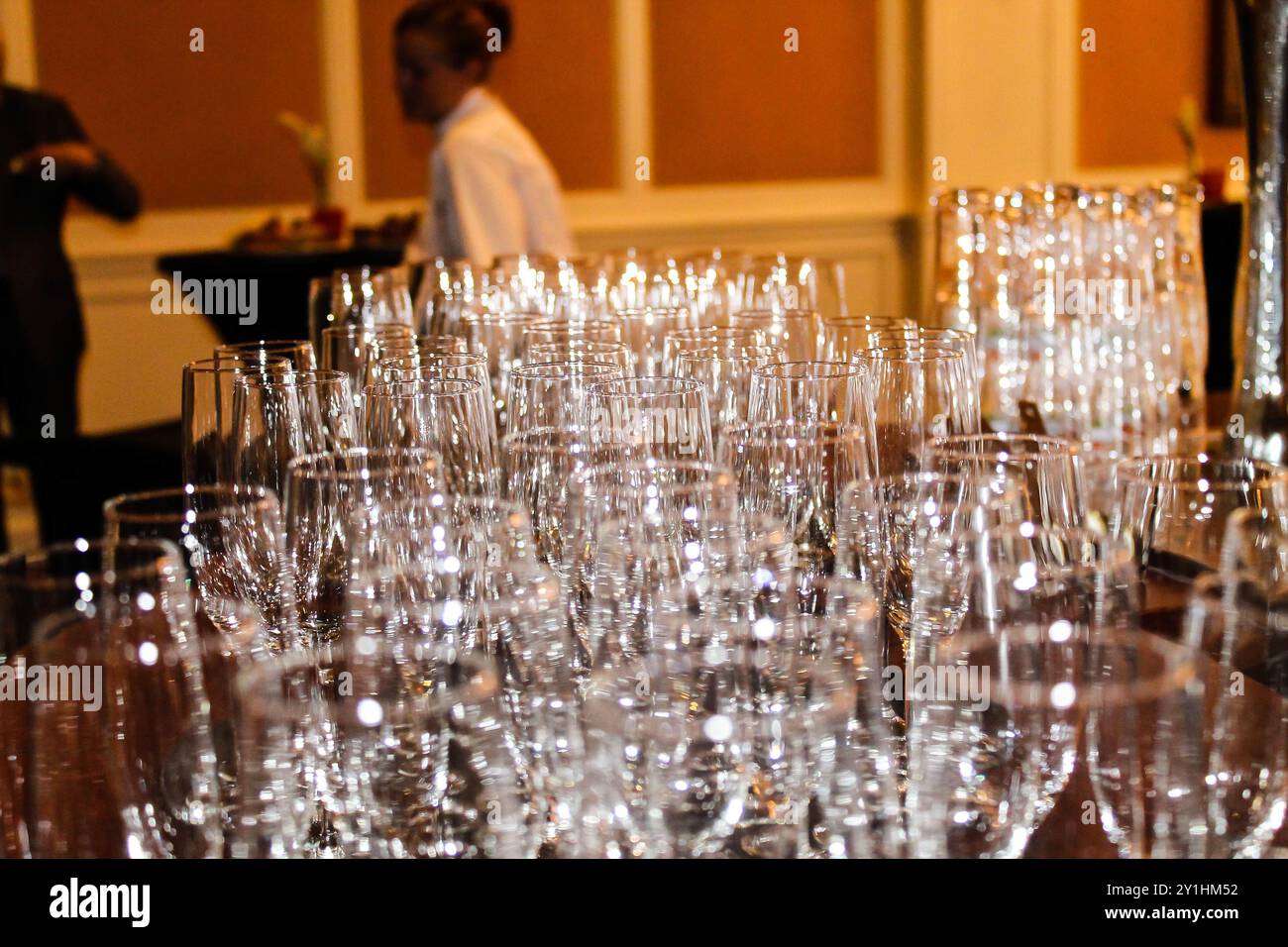 A collection of sparkling glassware arranged on a table, with a blurred ...