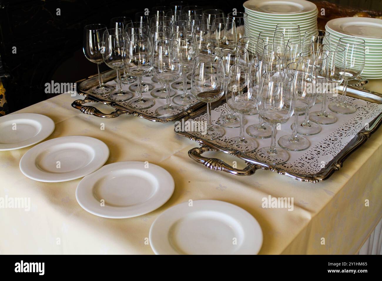 A beautifully arranged table setting featuring multiple trays of clear ...
