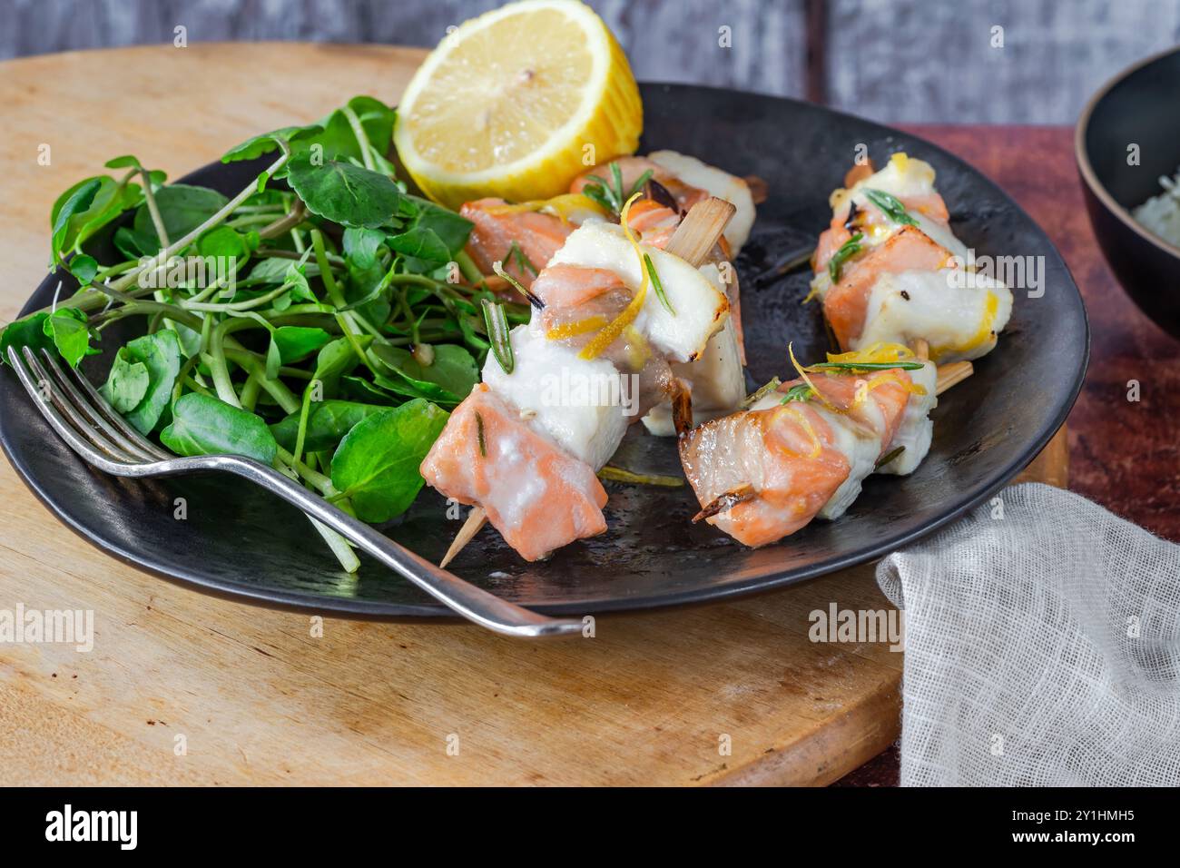 Mini salmon and halibut skewers marinated in honey, rosemary and lemon ...