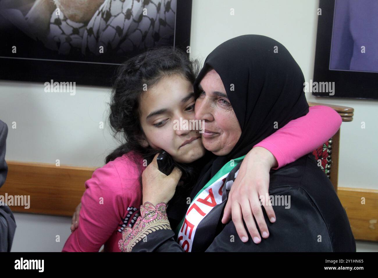 The mother (R) of Palestinian Dima al-Wawi, 12, who is believed to be ...