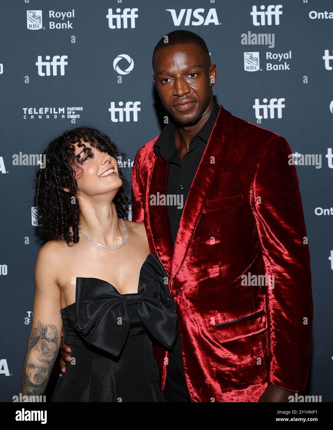 Stephen Adekolu (L) and guest attends the premiere of "The Cut" during ...