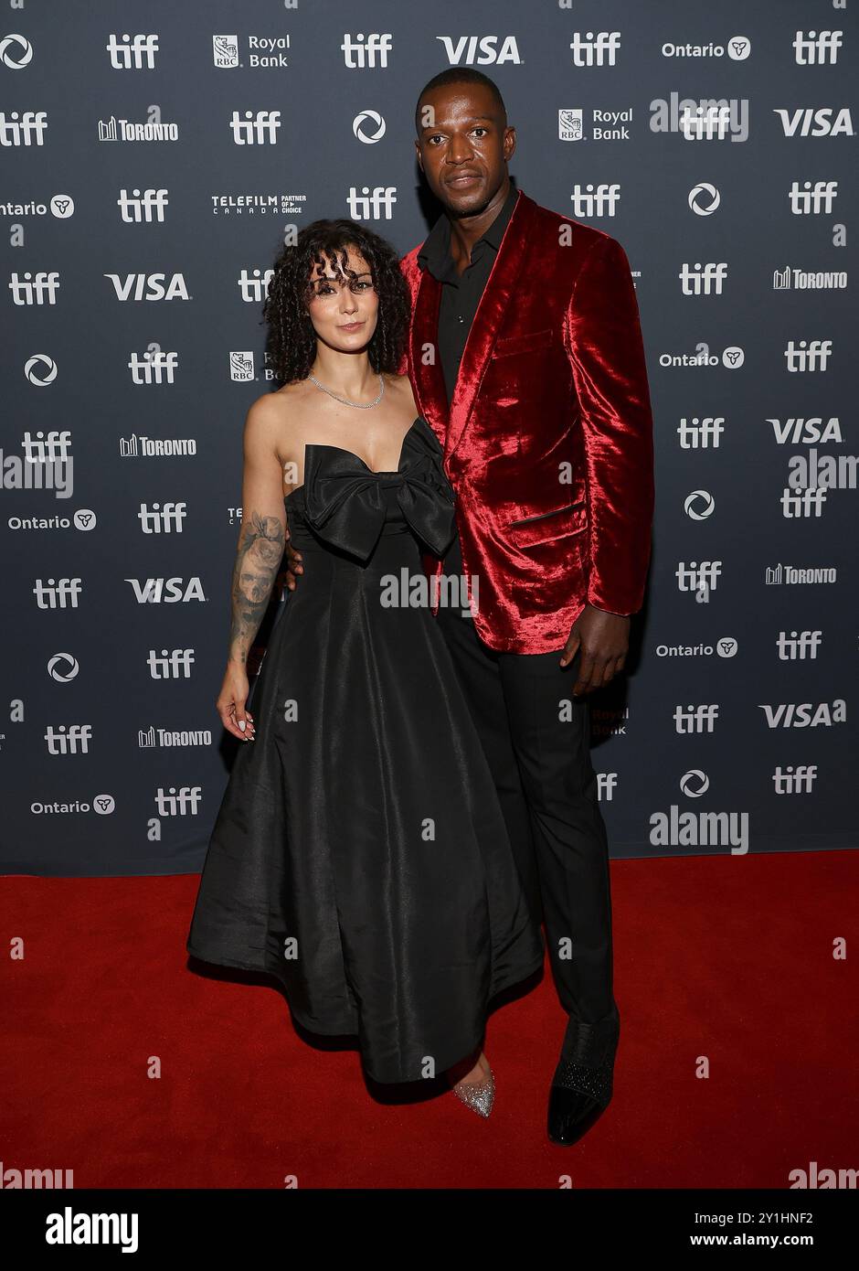 Stephen Adekolu (L) and guest attends the premiere of "The Cut" during ...