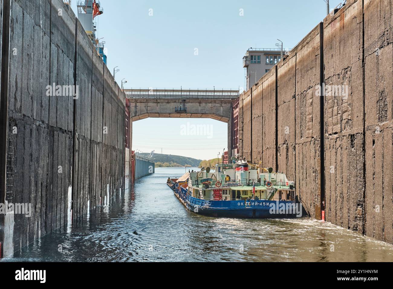 Tchaikovsky, Russia - May 20, 2024: Tugboat pushing barge after opening ...