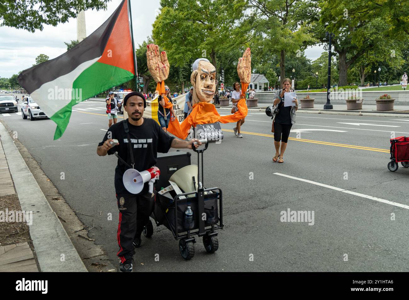 Washington DC, USA - 08/19/2024: A group of people are marching down ...