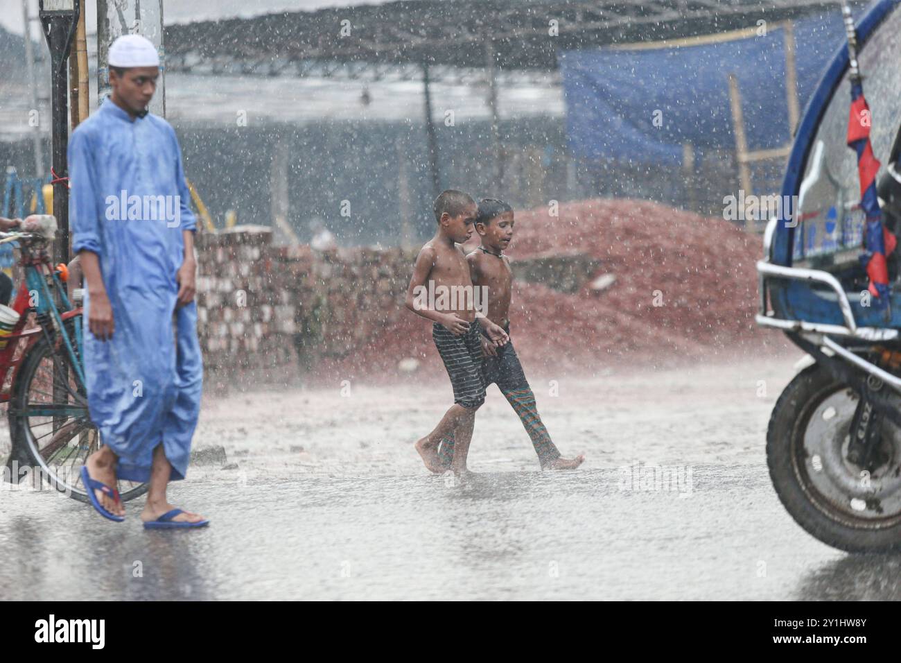 Monsoon Rain in Dhaka, Bangladesh People crosses a street during heavy rainfall in Dhaka on ...