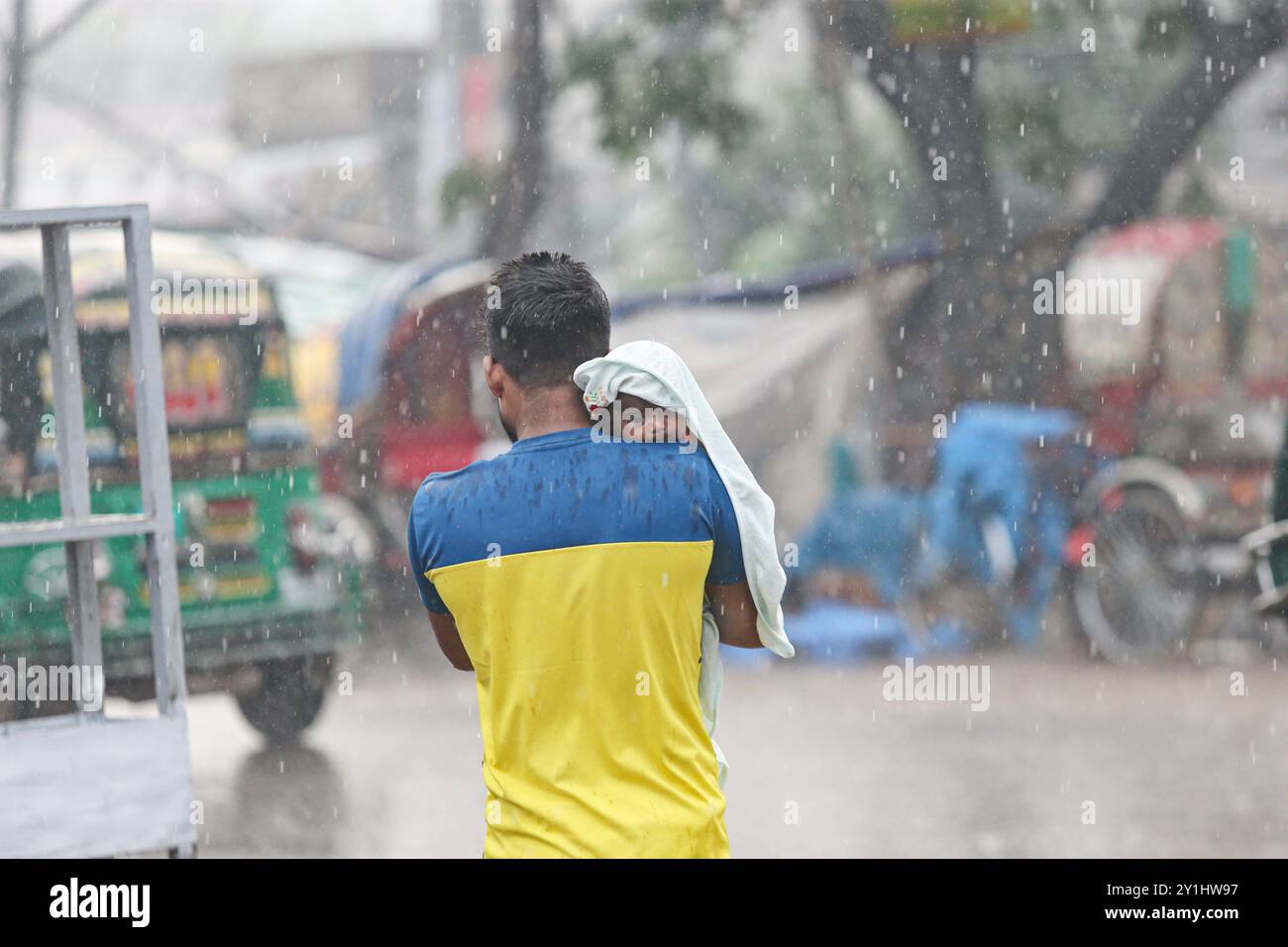 Monsoon Rain in Dhaka, Bangladesh People crosses a street during heavy rainfall in Dhaka on ...