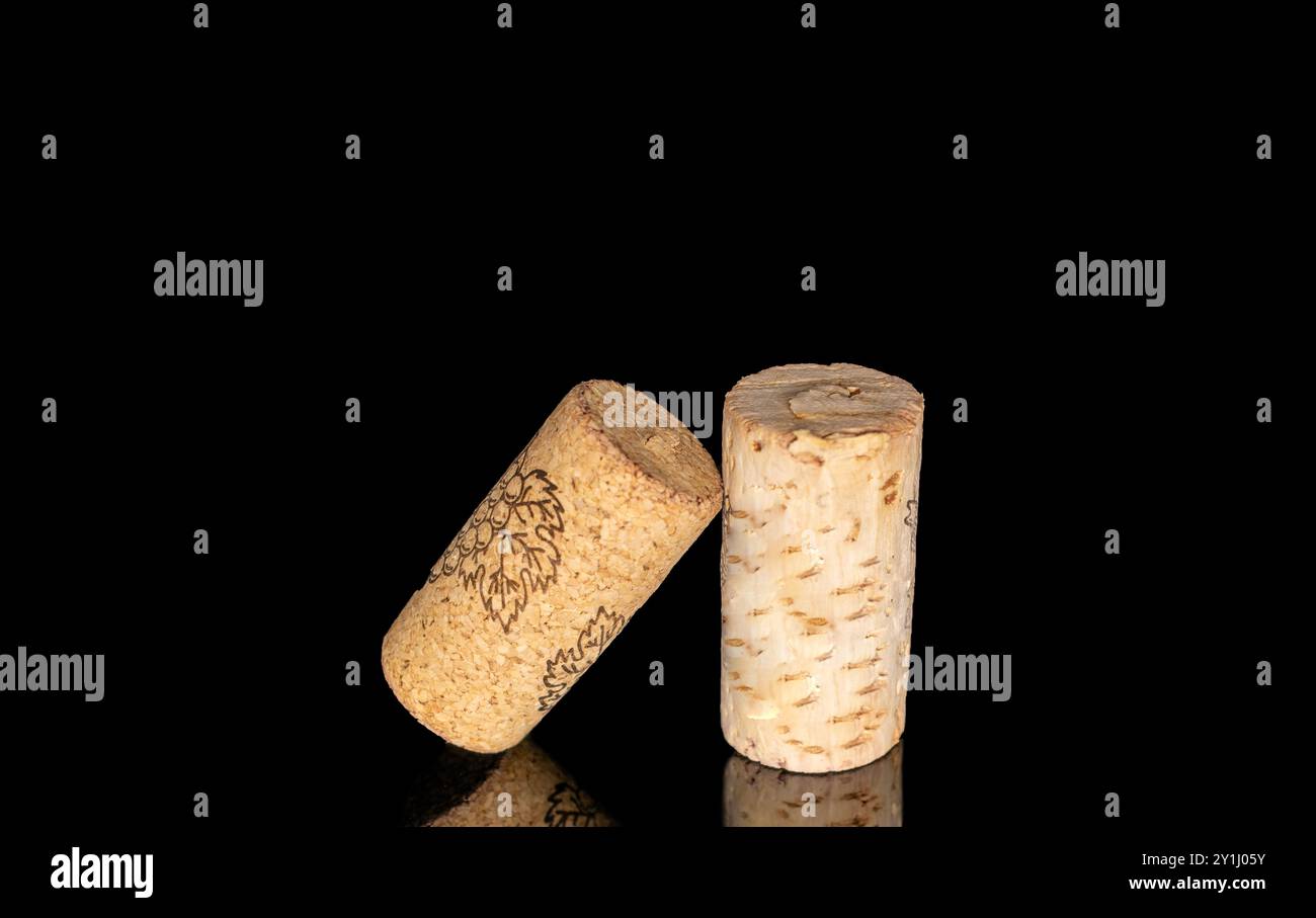 Two wine corks, macro, isolated on black background Stock Photo - Alamy
