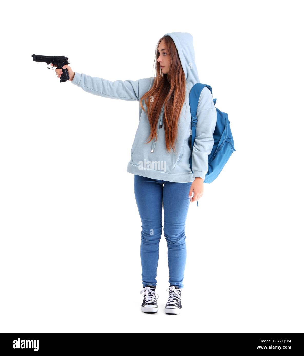 Female student with gun on white background. School shooting concept ...