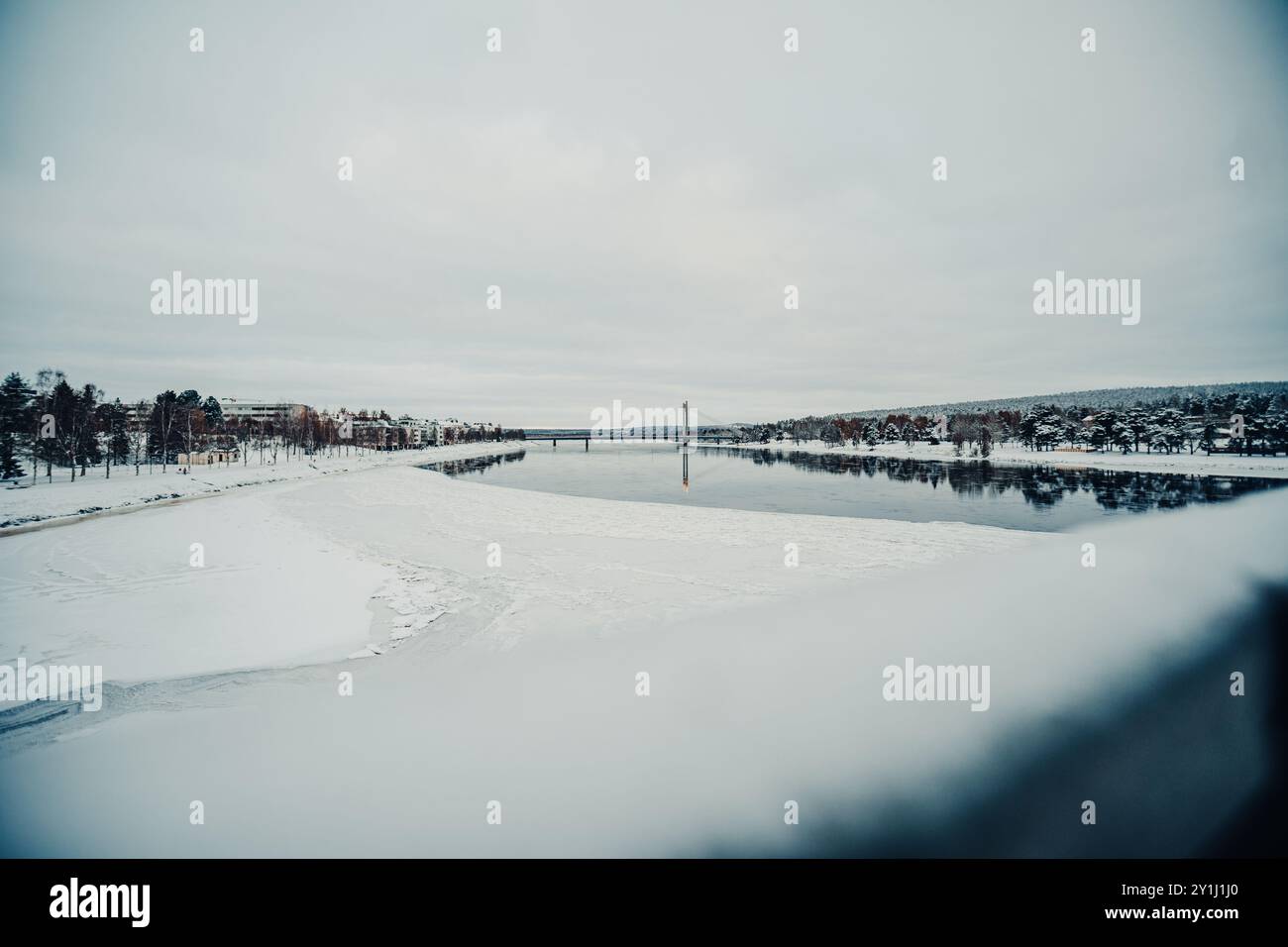Half frozen Ounasjoki river in Rovaniemi, Lapland shot from railway ...