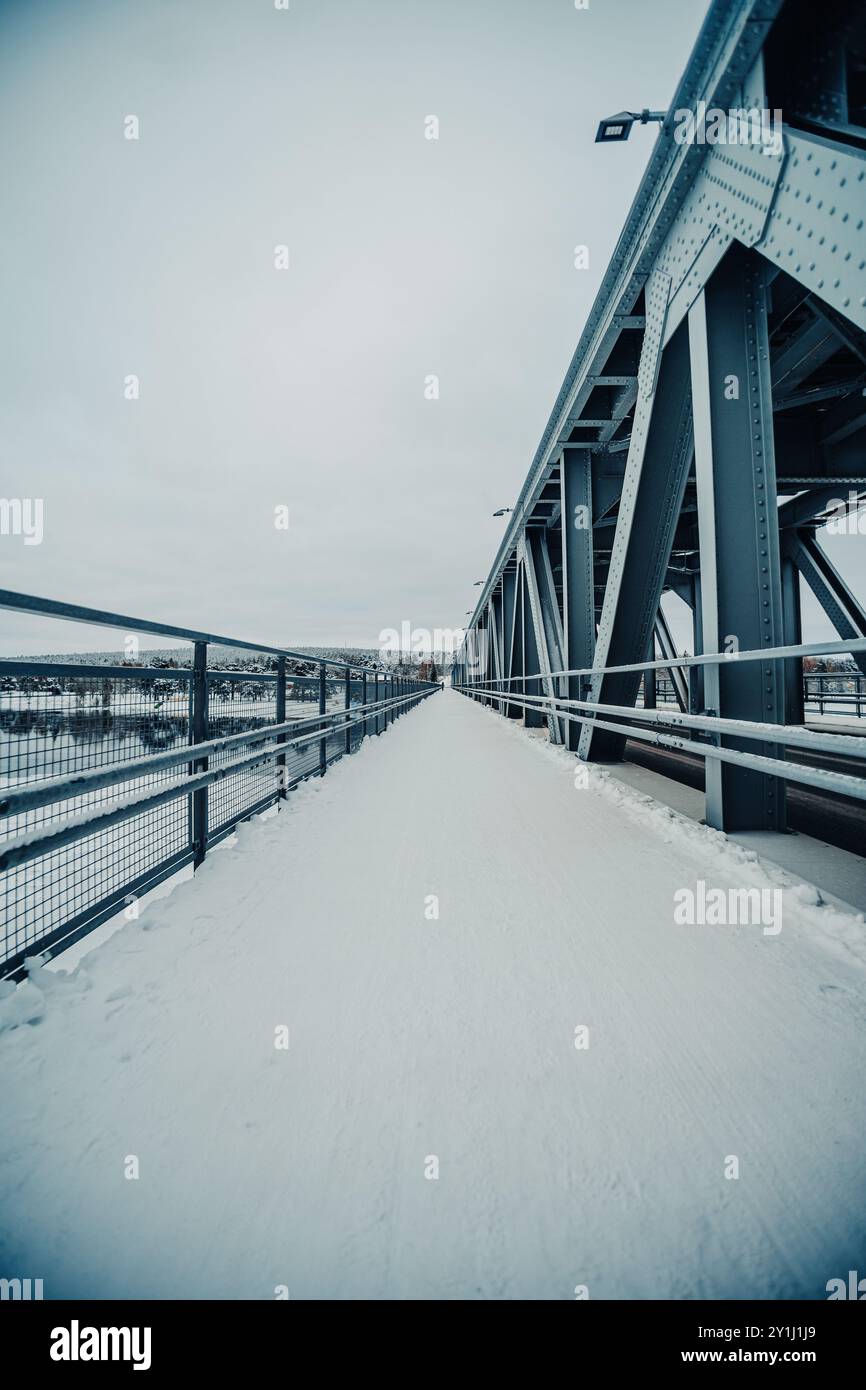 Snowy path over Rovaniemi railway bridge in winter in Lapland Stock ...