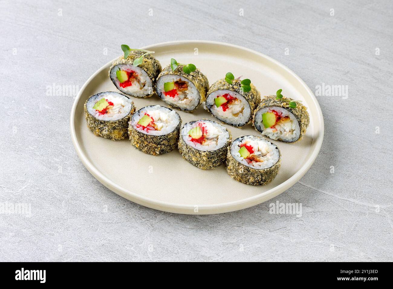 Japanese sushi tempura maki crab meat and tobiko roll on slate ...