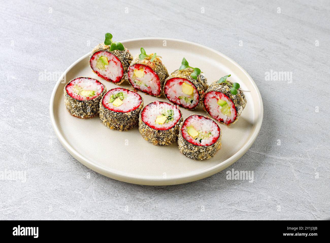 Japanese sushi tempura maki crab meat and tobiko roll on slate ...