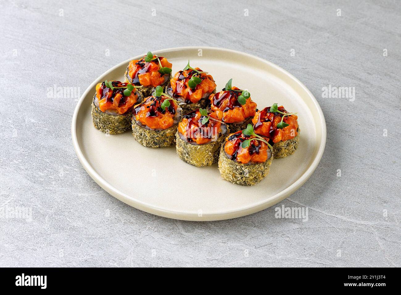 Japanese sushi tempura maki crab meat and tobiko roll on slate ...