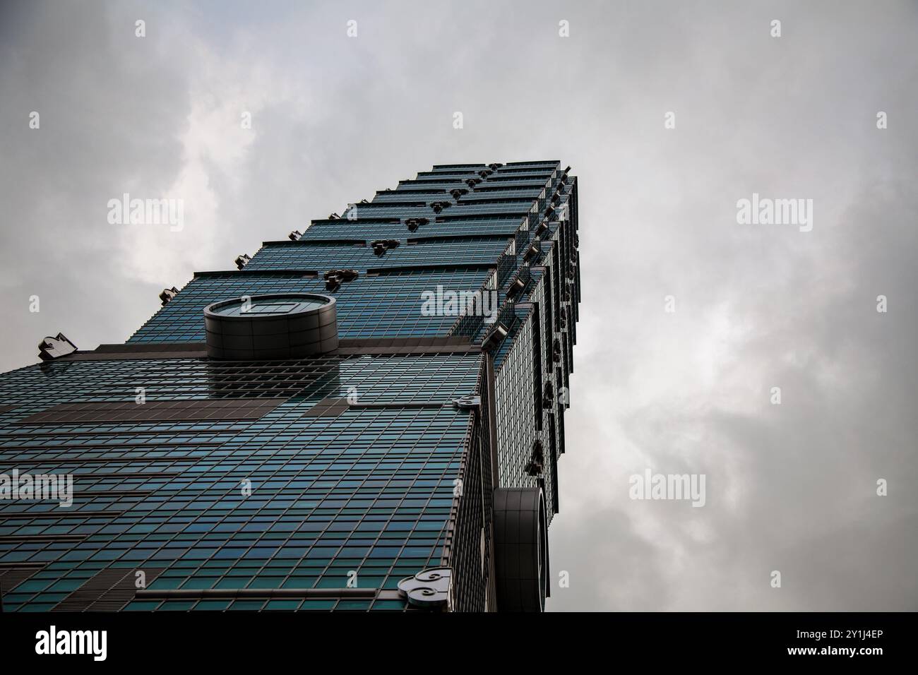 The landmark Taipei 101 under dramatic clouds during a rainstorm in ...