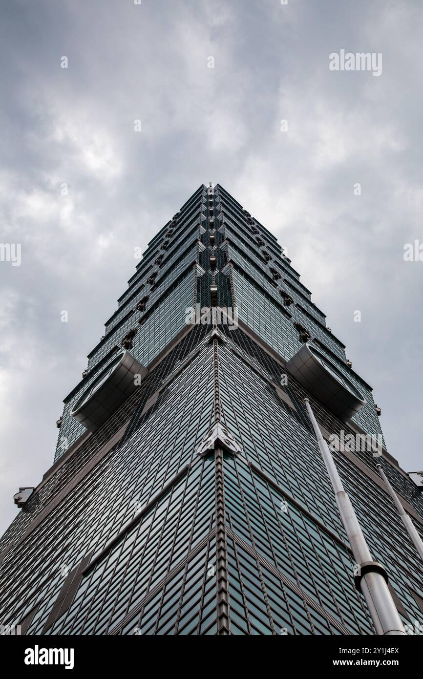 The landmark Taipei 101 under dramatic clouds during a rainstorm in ...