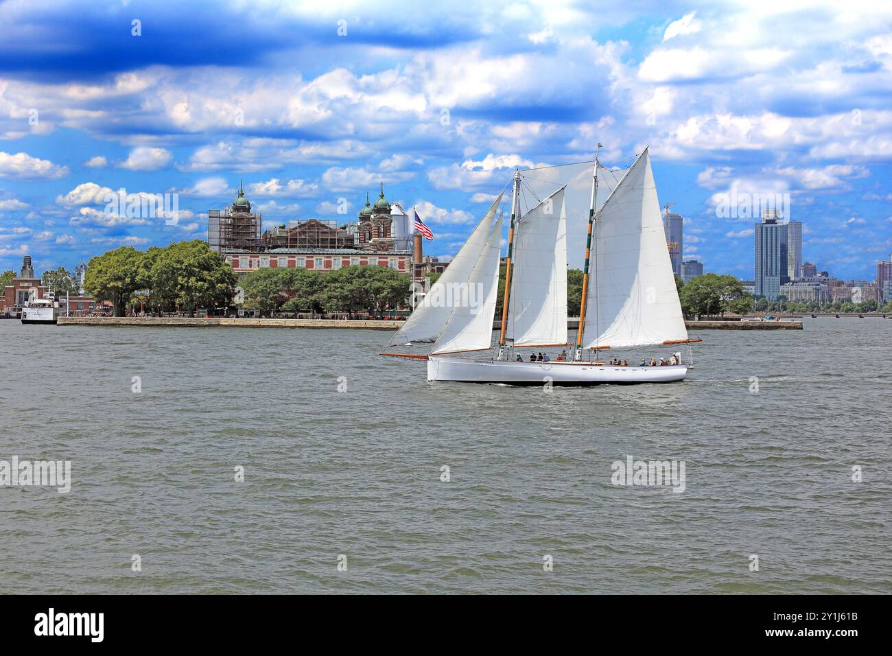 The 80 ft. long schooner tour boat 'Adirondack' passing by Ellis Island ...