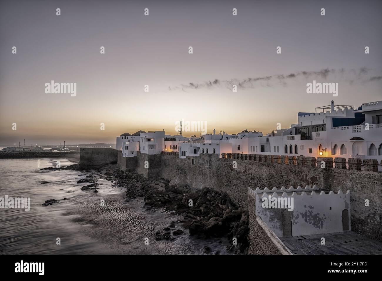 Asilah or Assilah waterfront at dawn. Sunrise over the Medina of a ...