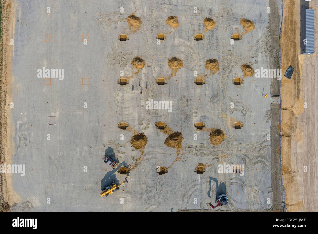 Aerial view of construction site backhoe digging holes, Pennsylvania ...