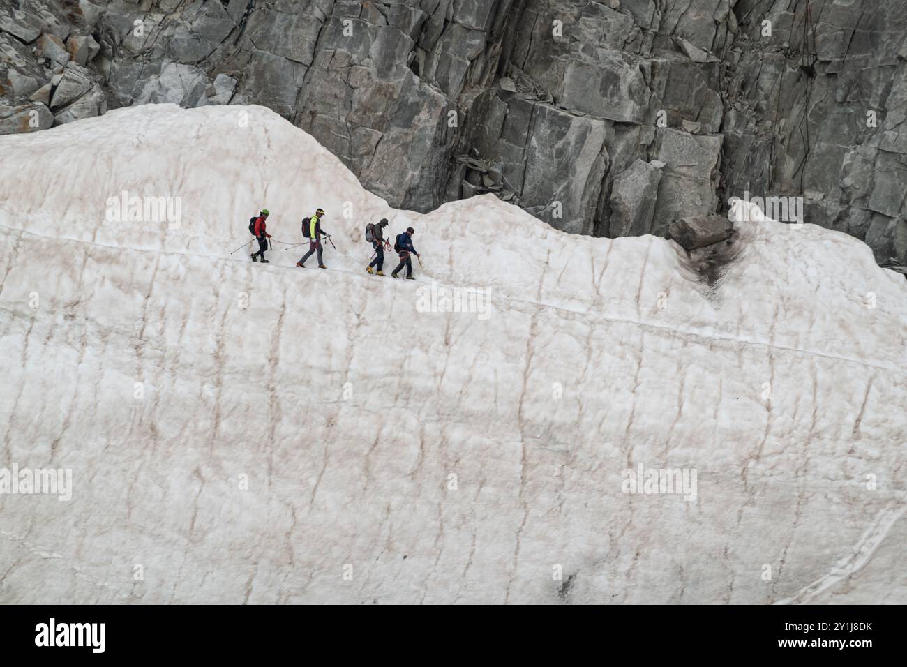 Chamonix, France - 22 August, 2024: 4 roped together climbers ...