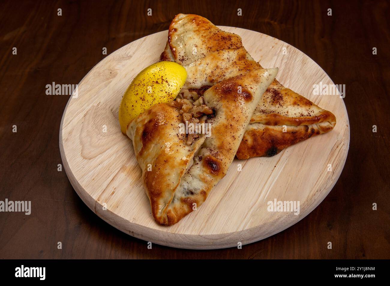 Plate with several different types of cheese fatayer, with minced lamb ...