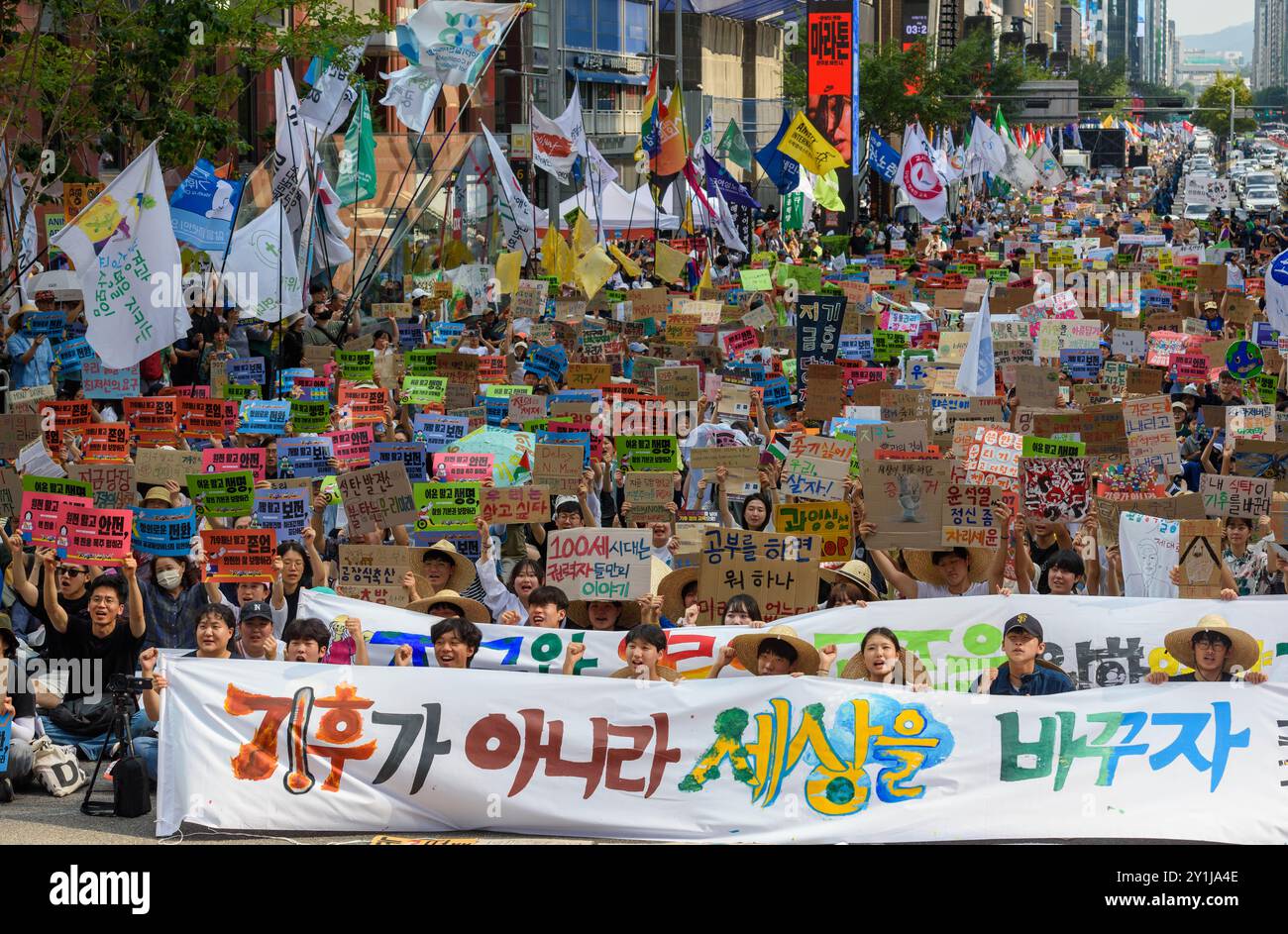 South Korean environmental activists hold banners and placards during a ...
